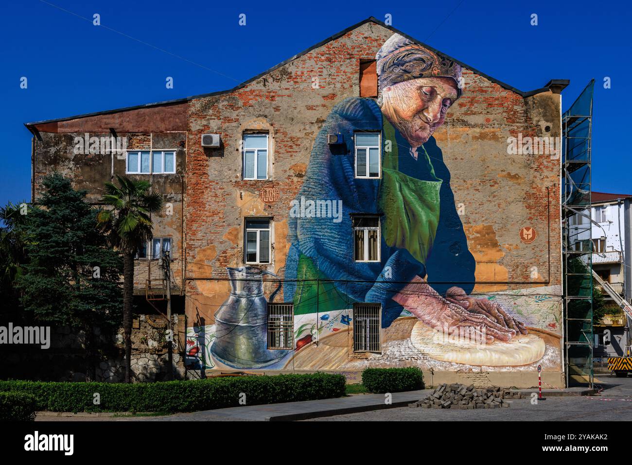 the street art mural of with love by sasha korban of a georgian woman ...