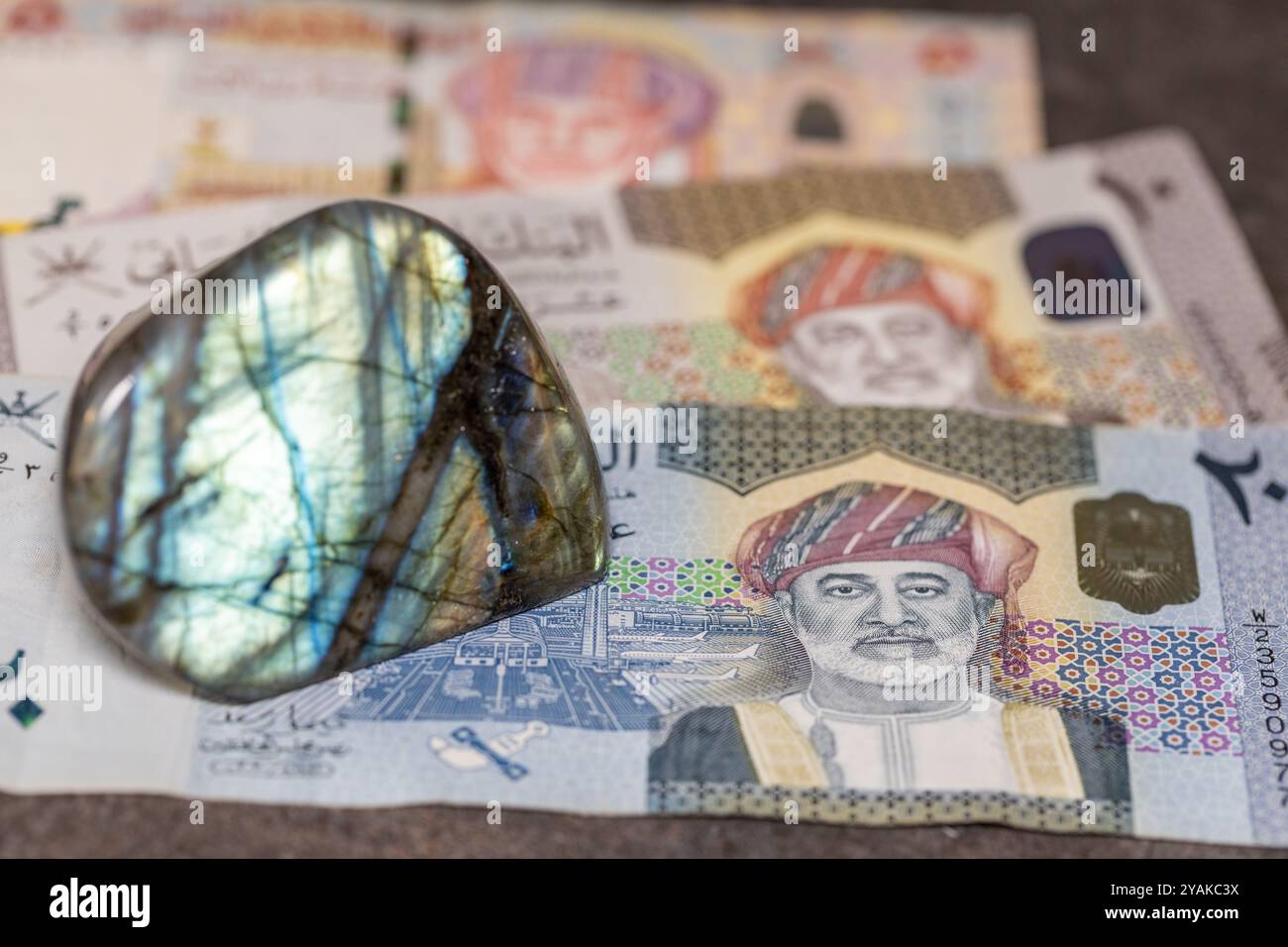 Oman money. Omani rials banknotes lying on the table with a precious ...