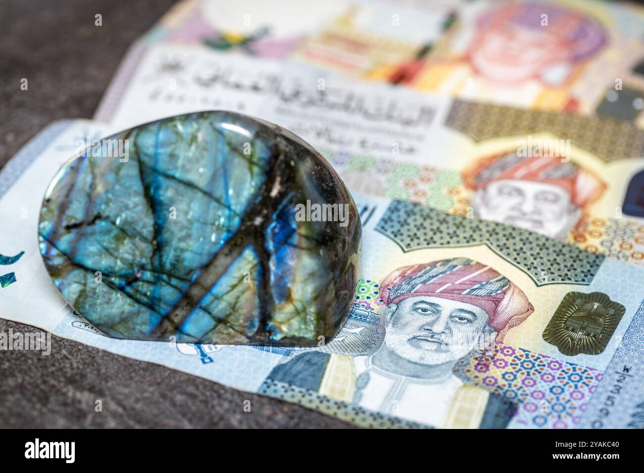 Oman money. Omani rials banknotes lying on the table with a precious ...