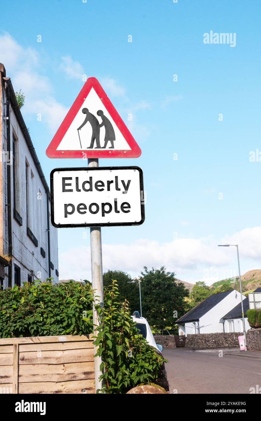 Warning sign on side of road Elderly people crossing in village of ...