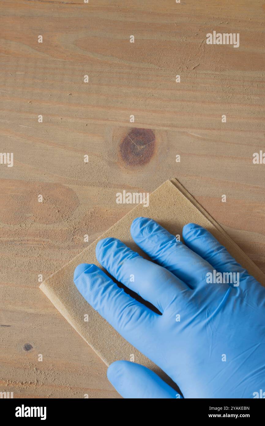 Person sanding wood board using coarse 80 grit grained sandpaper. Do it ...