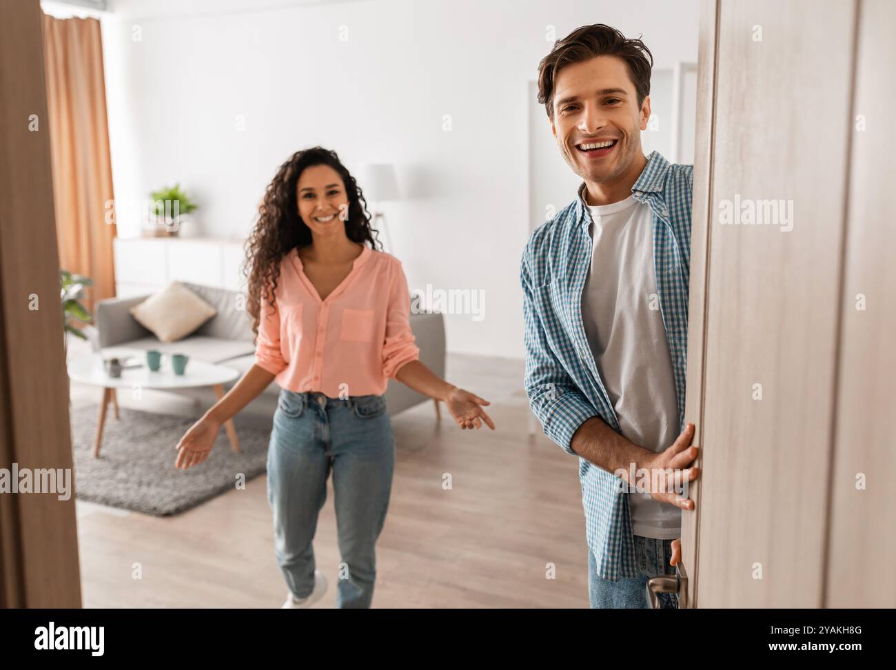 Man woman female couple entering front entrance hi-res stock ...