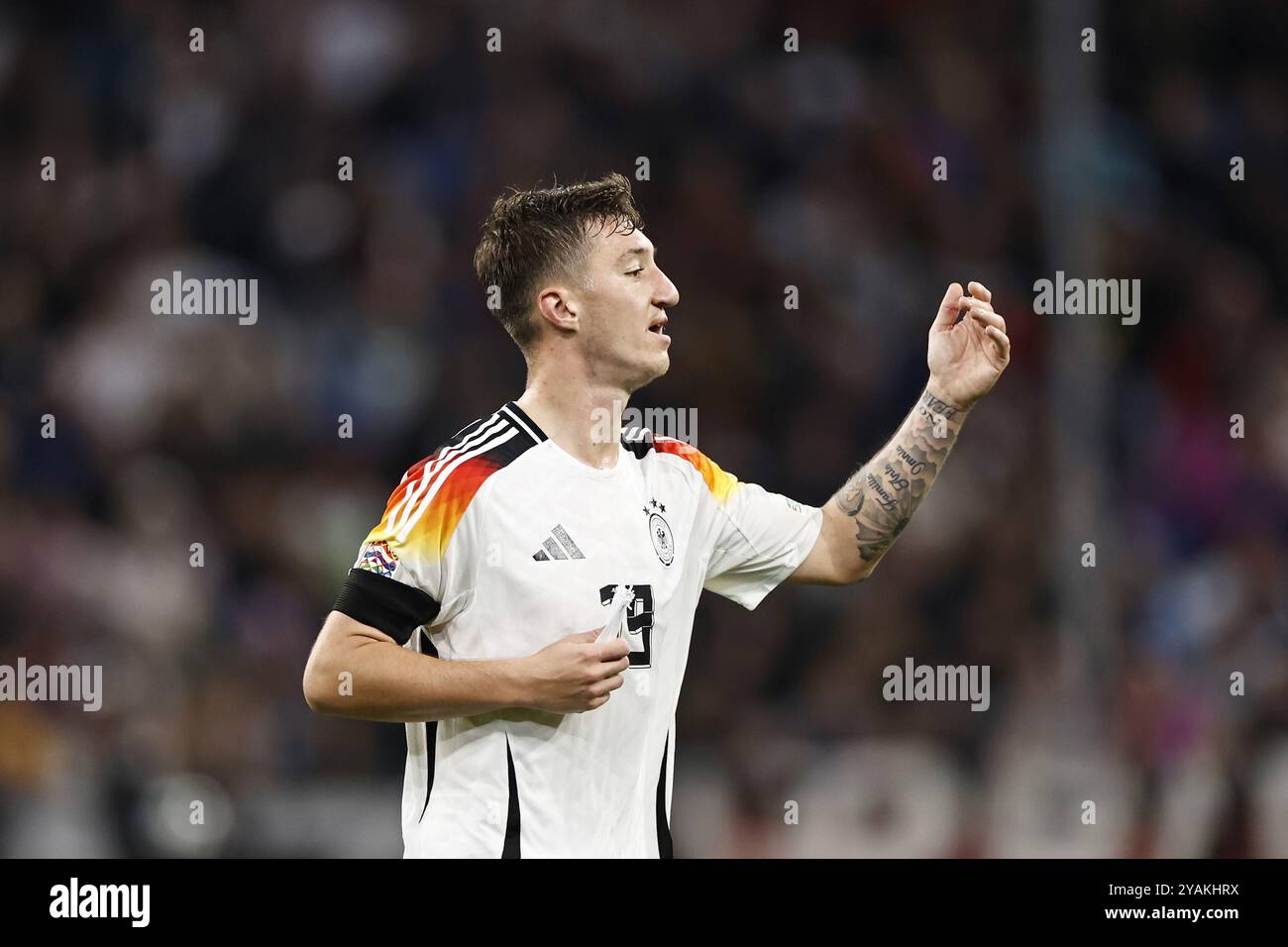 MUNCHEN - Angelo Stiller of Germany with a bill of tactics during the ...