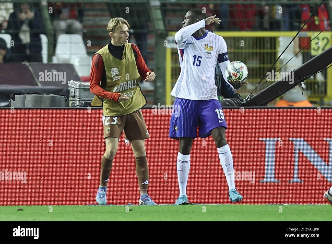 Belgium's Matte Smets and France's Ibrahima Konate fight for the ball ...