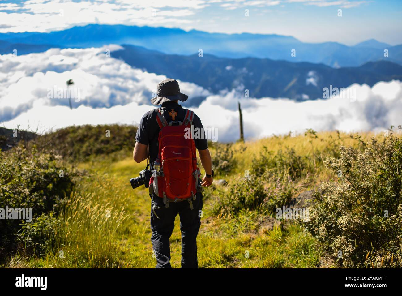 Young man hiking in the mountains of Sierra Nevada de Santa Marta ...