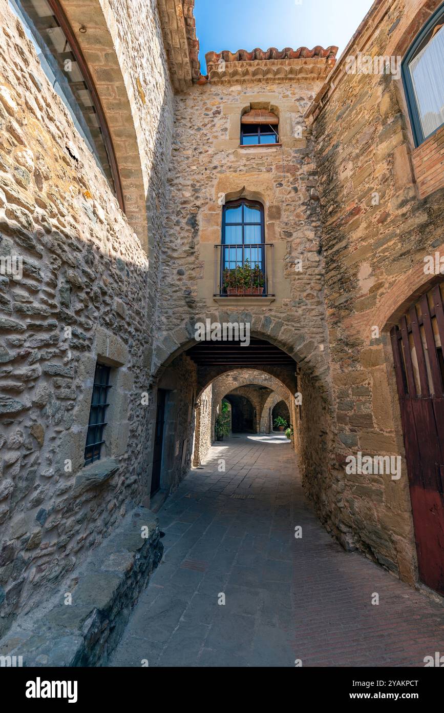street of a medieval village, with the floor, walls and arches made of ...