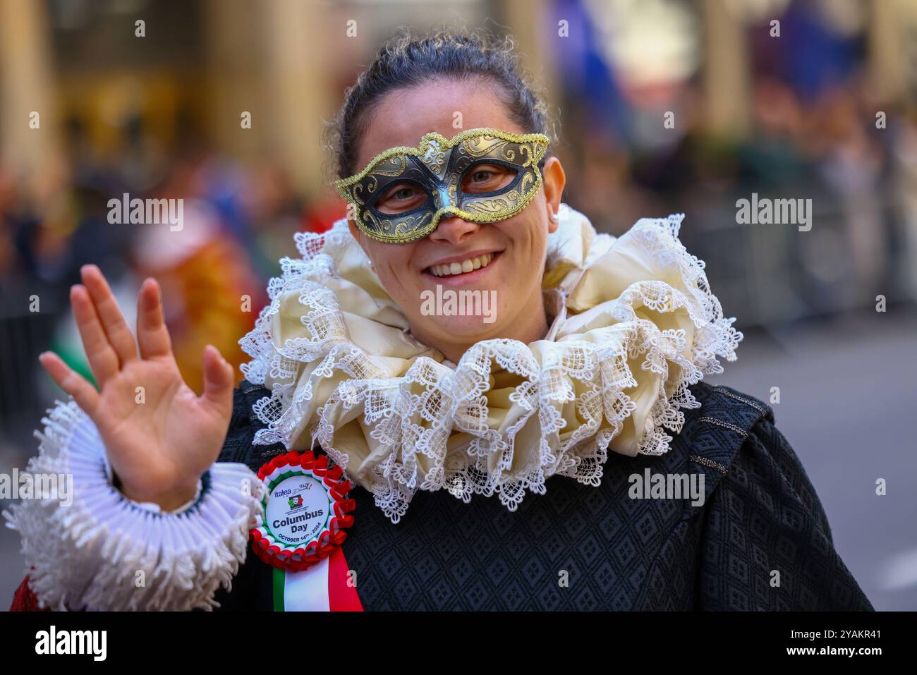 Performers in costume pose for a photo during the Columbus Day Parade ...