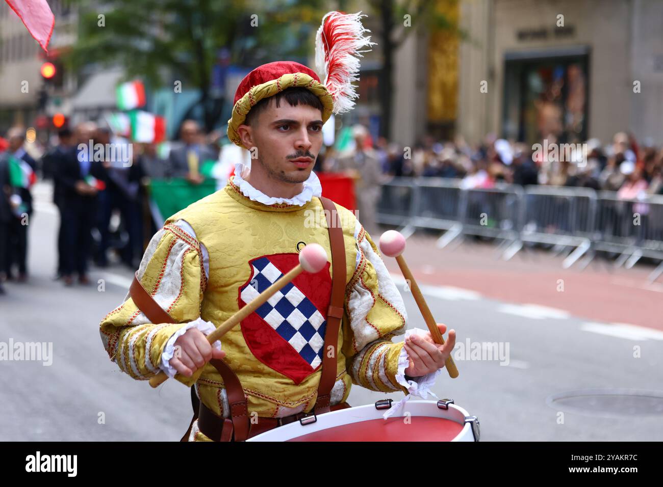 Performers in costume pose for a photo during the Columbus Day Parade ...