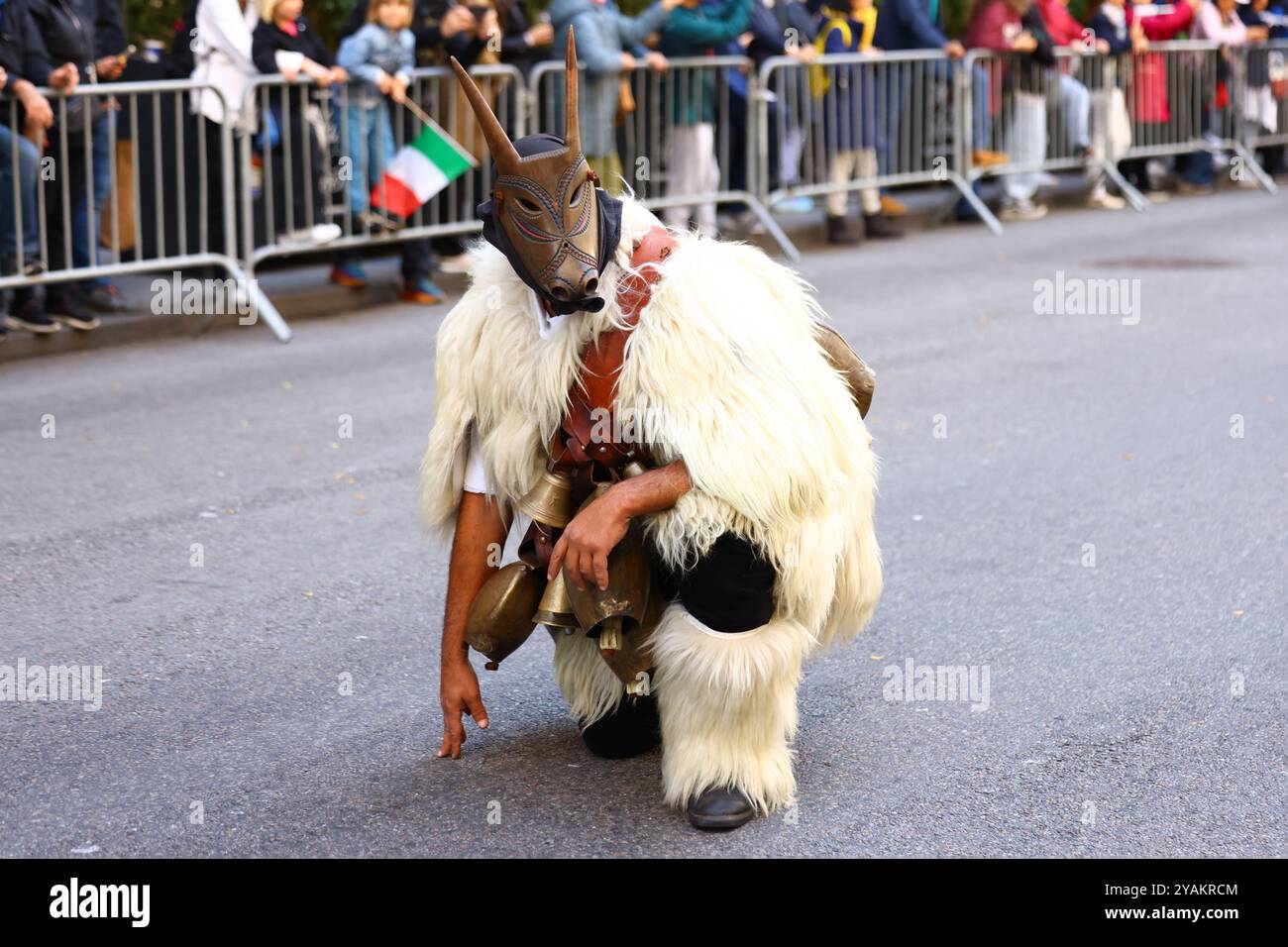 Performers in costume pose for a photo during the Columbus Day Parade ...