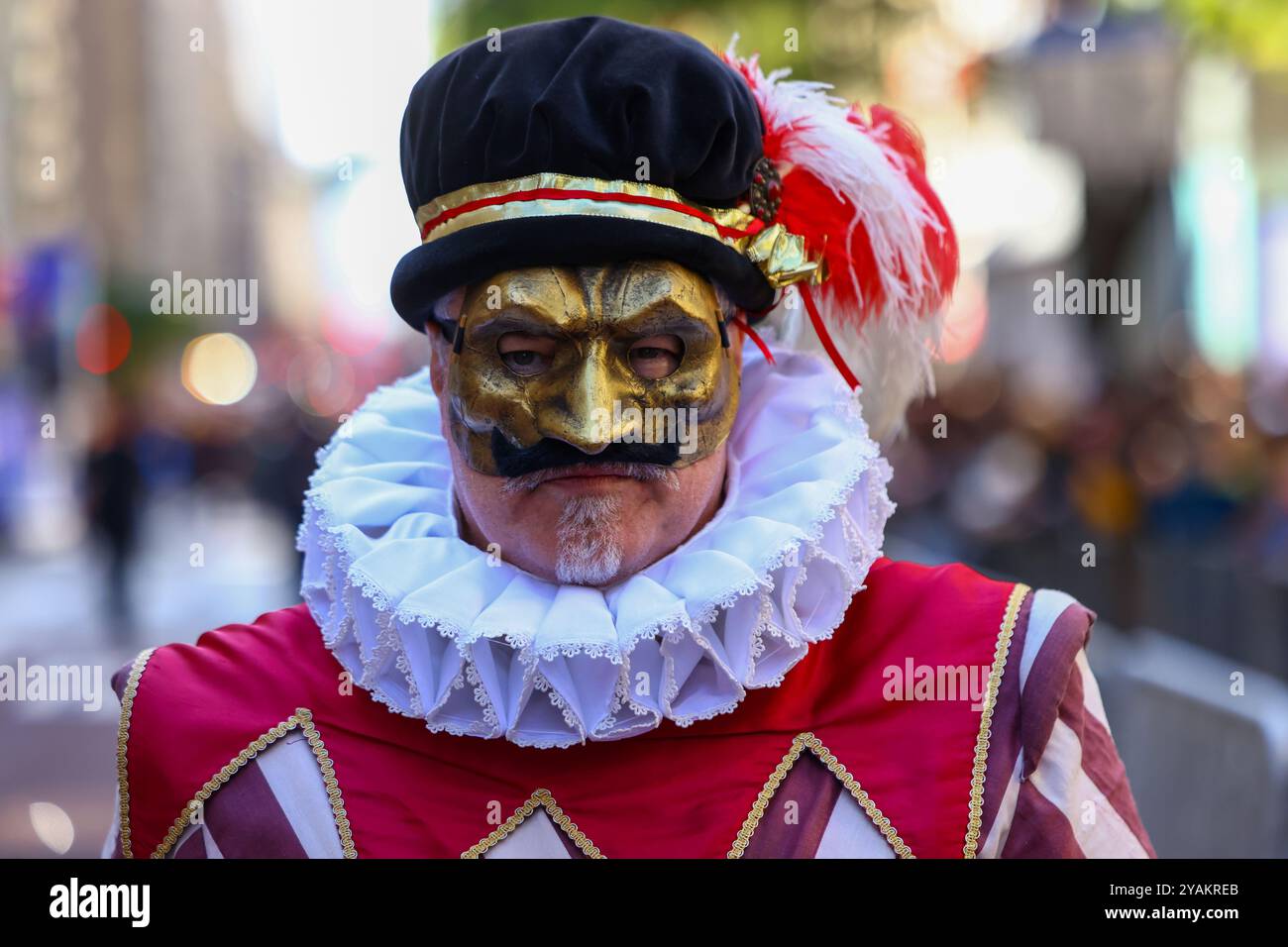 Performers in costume pose for a photo during the Columbus Day Parade ...