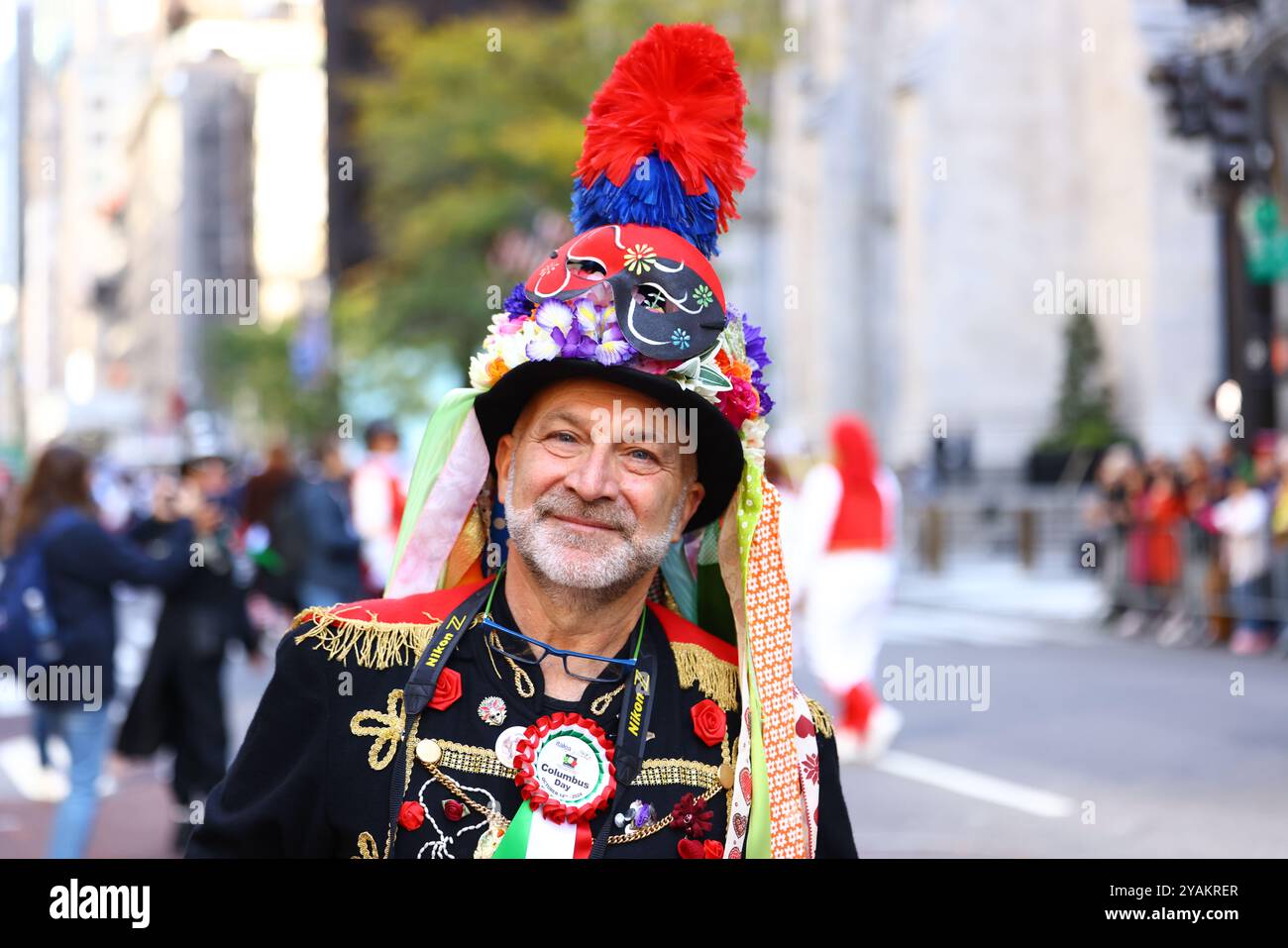 Performers in costume pose for a photo during the Columbus Day Parade ...
