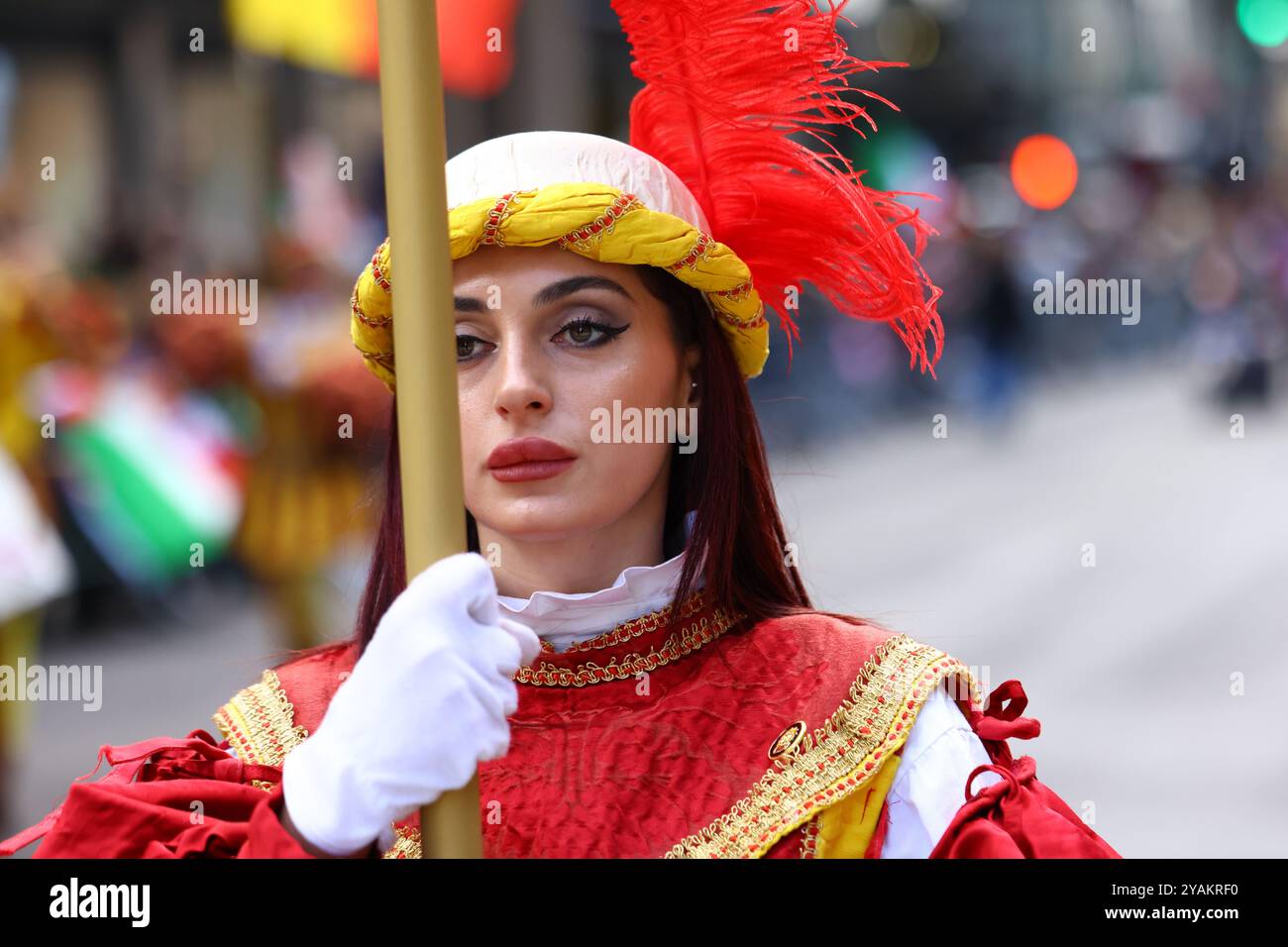 Performers in costume pose for a photo during the Columbus Day Parade ...