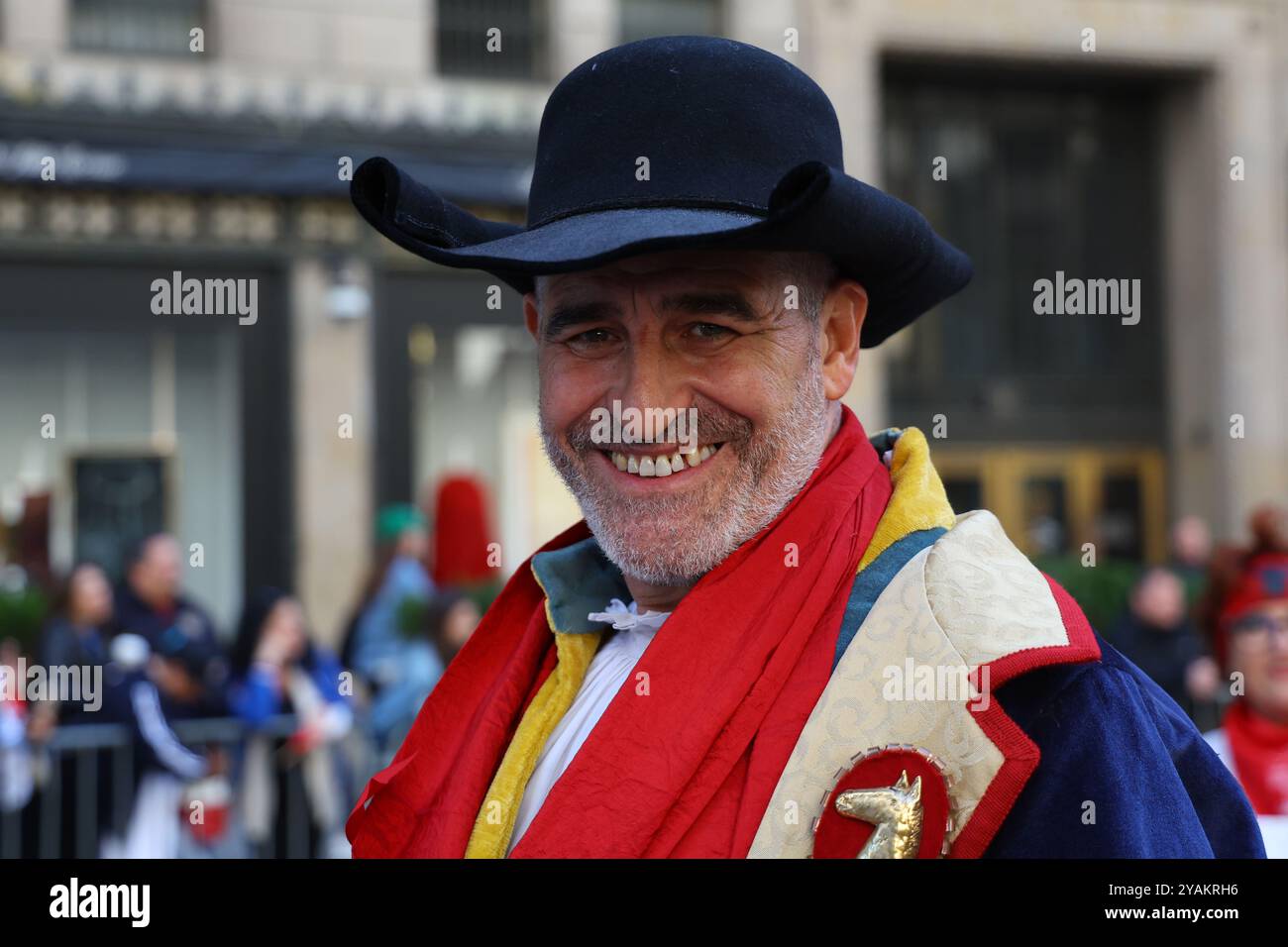 Performers in costume pose for a photo during the Columbus Day Parade ...