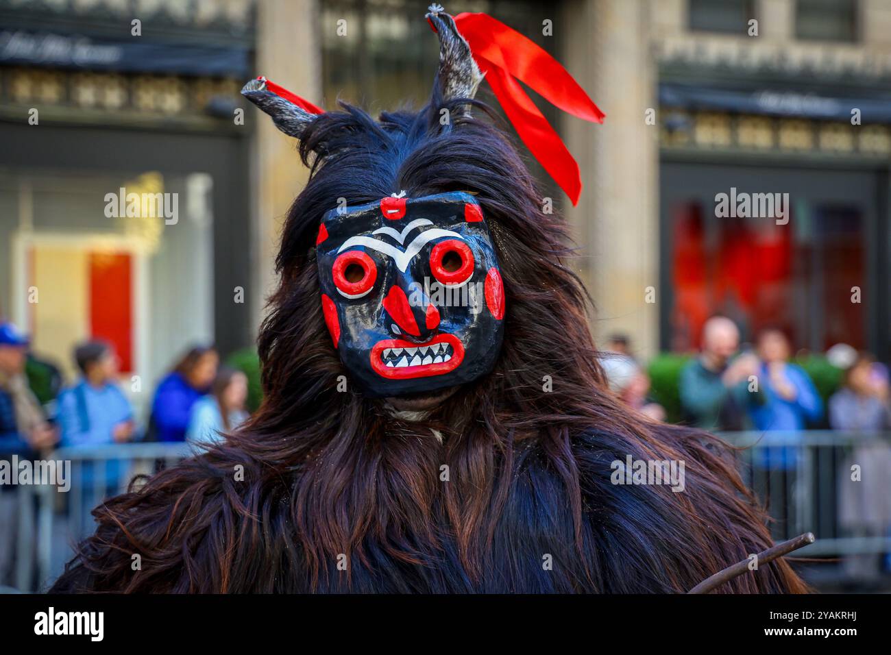 Performers in costume pose for a photo during the Columbus Day Parade ...