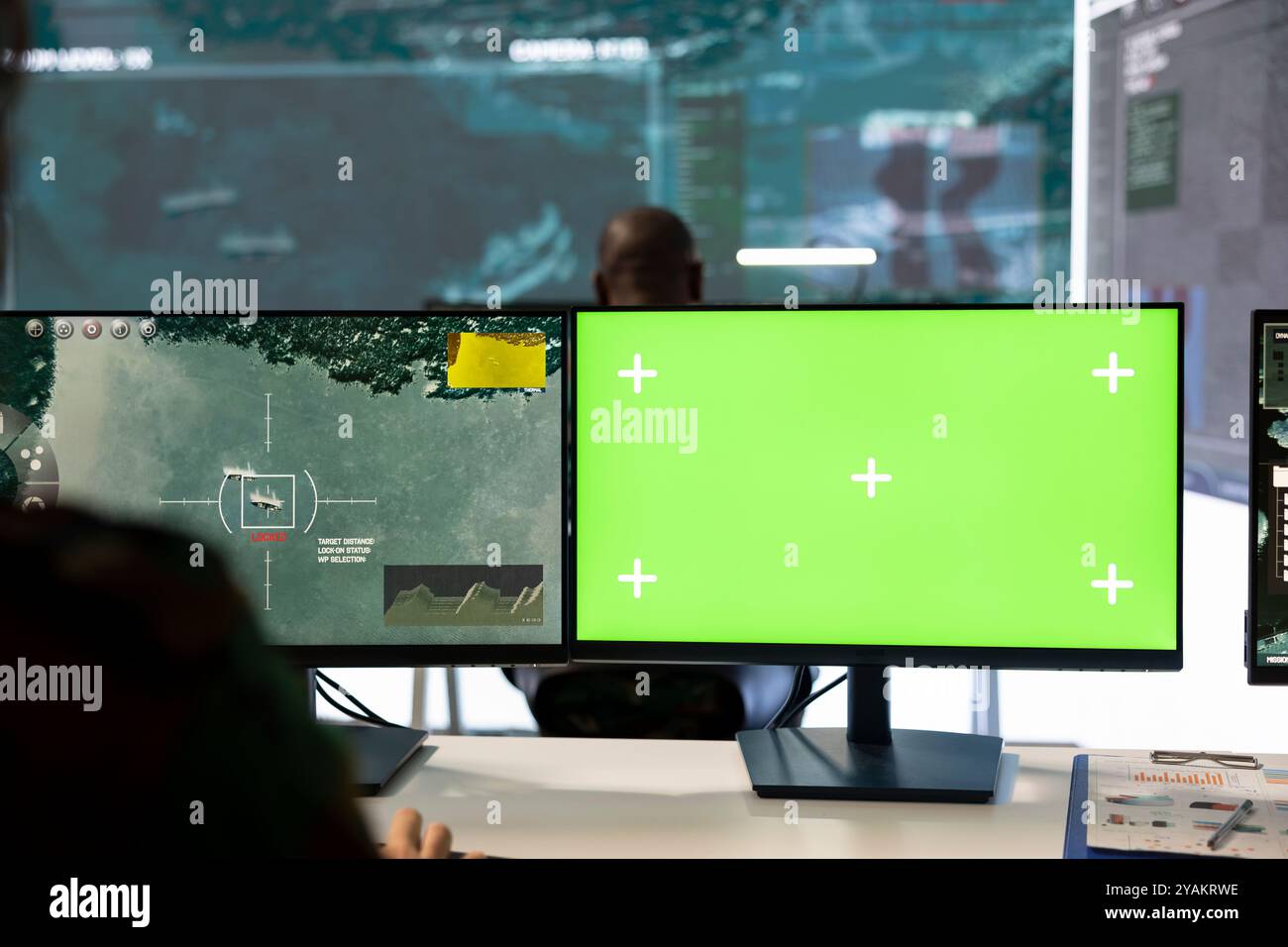 Army specialist examines satellite CCTV surveillance and copy space ...