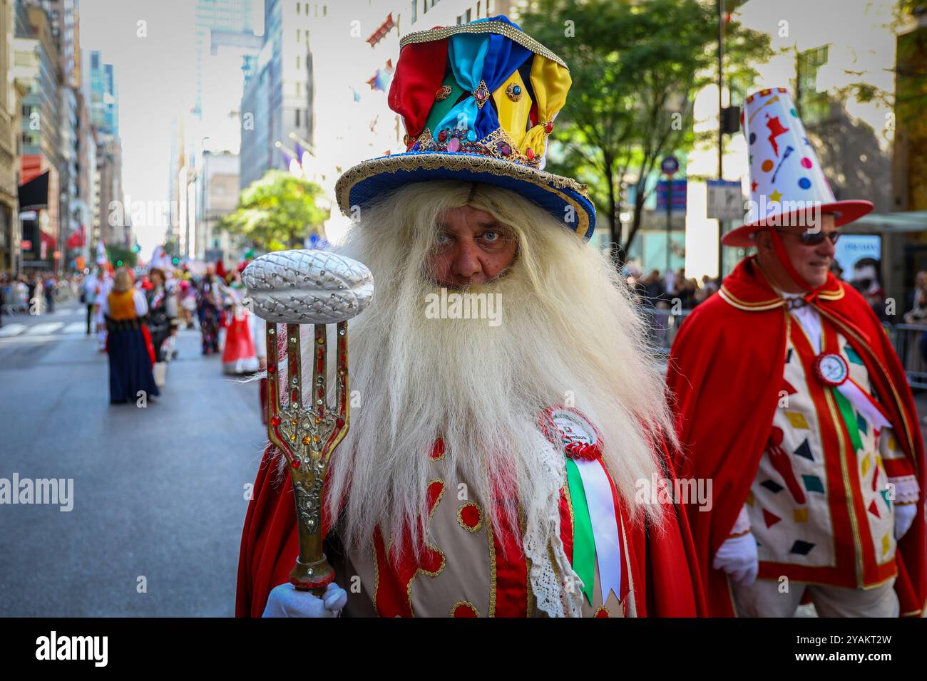 Performers in costume pose for a photo during the Columbus Day Parade ...