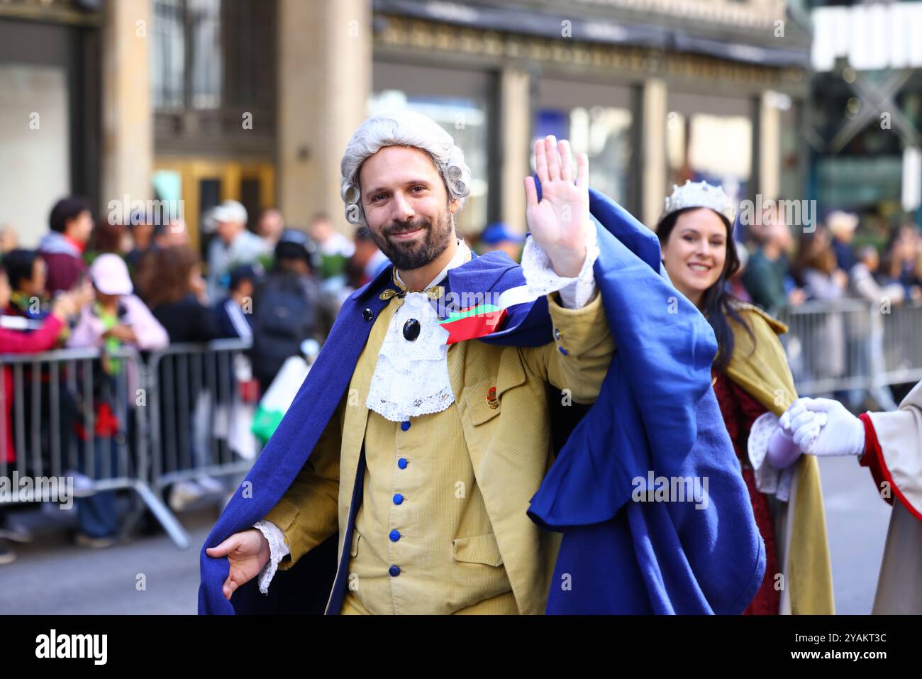 Performers in costume pose for a photo during the Columbus Day Parade ...