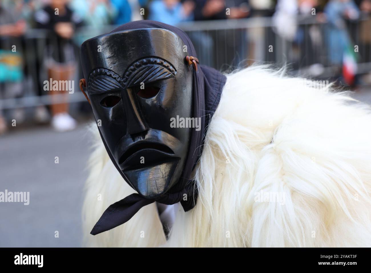 Performers in costume pose for a photo during the Columbus Day Parade ...