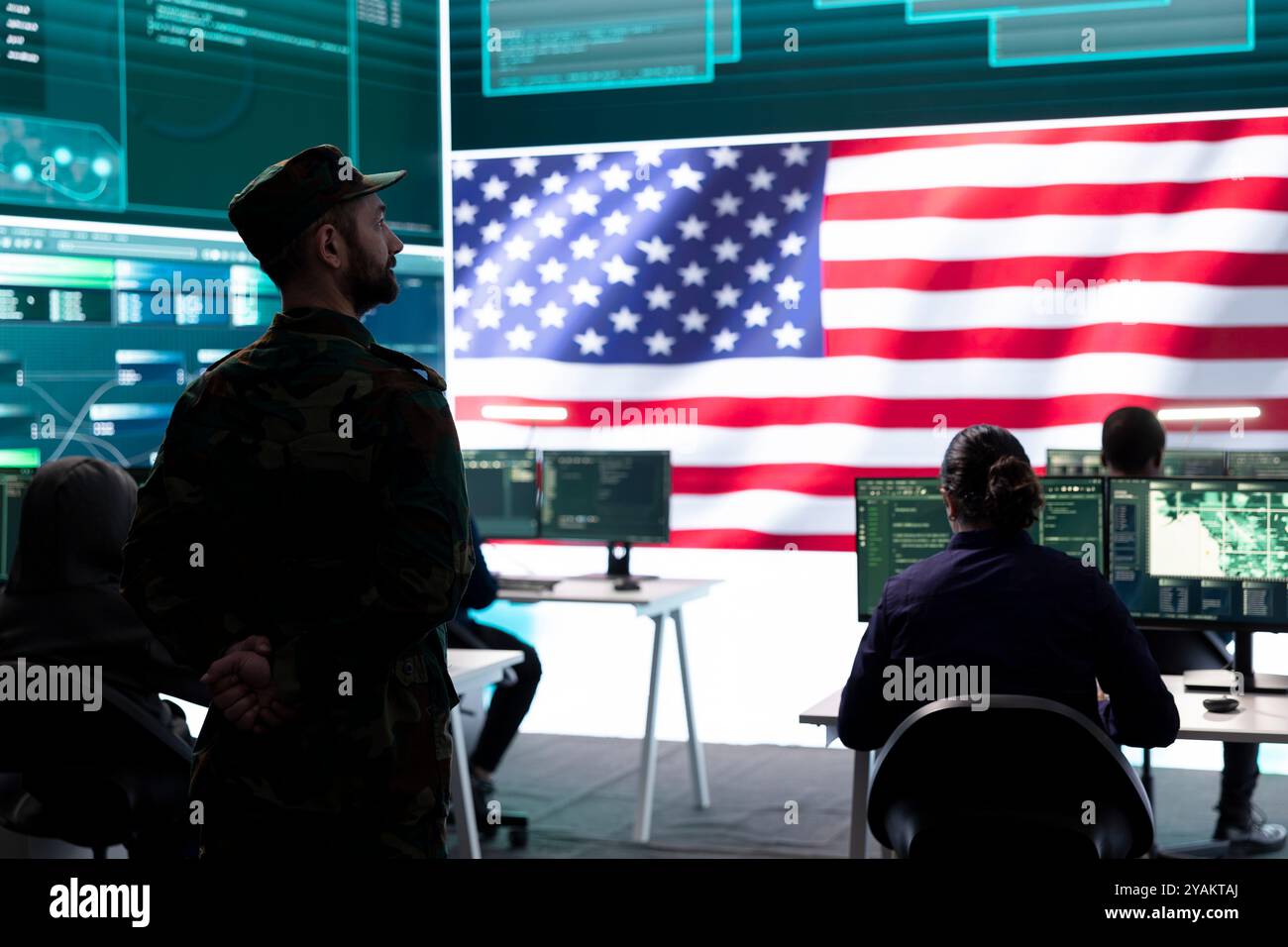 US military man supervising threat detection activity in high tech ...