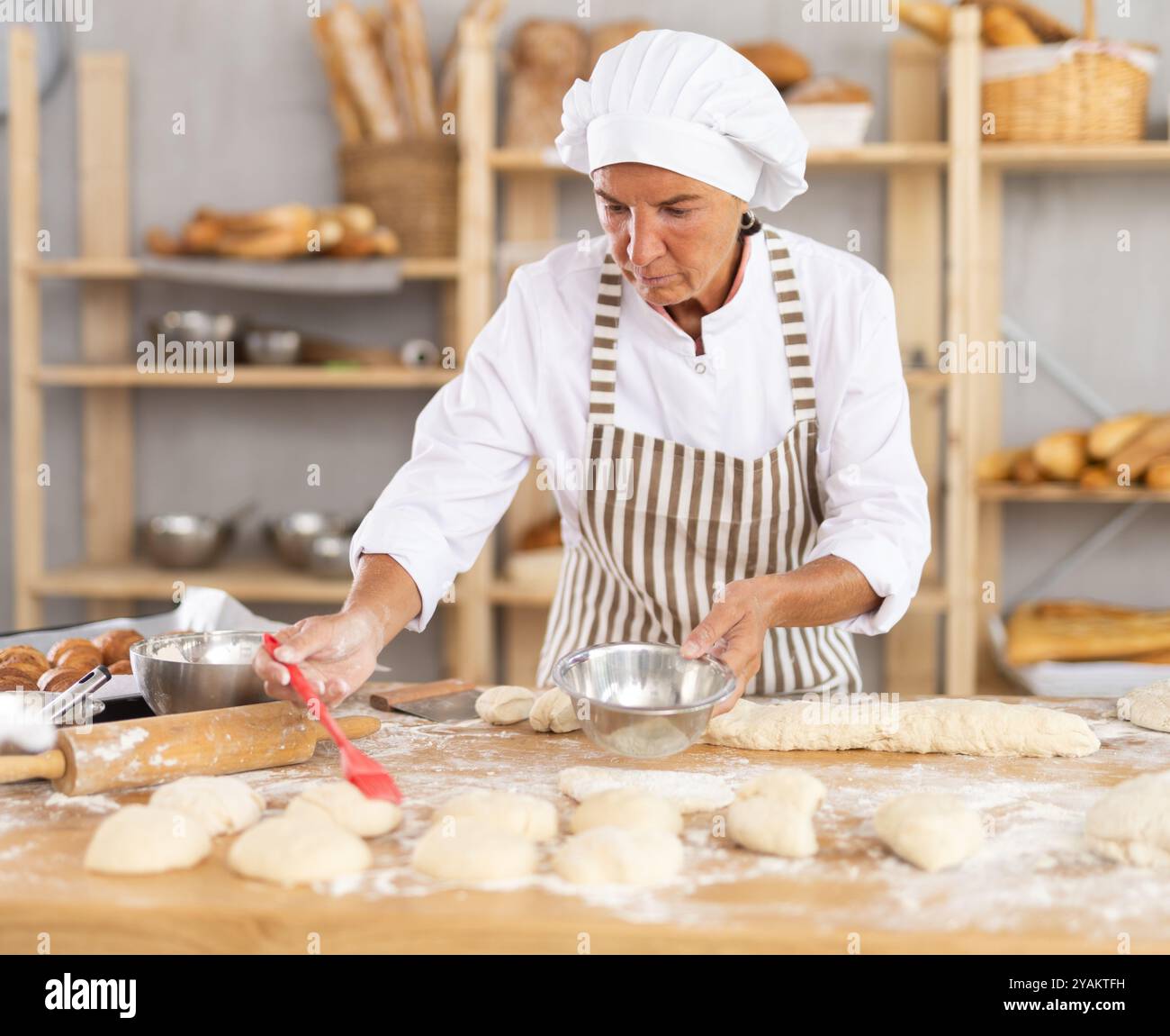 Woman buttering bread hi-res stock photography and images - Alamy