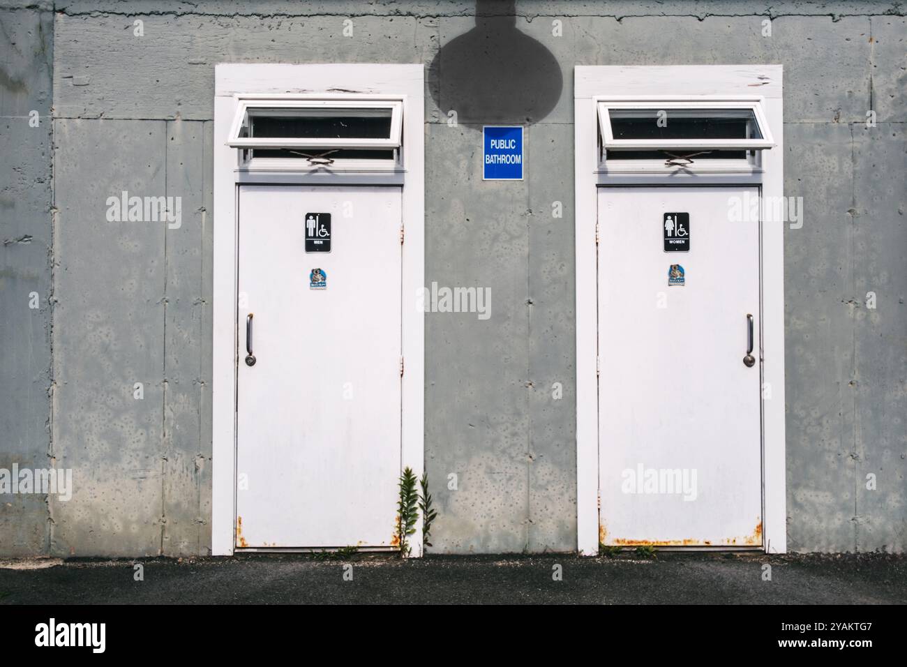 Two white public bathroom doors Stock Photo - Alamy