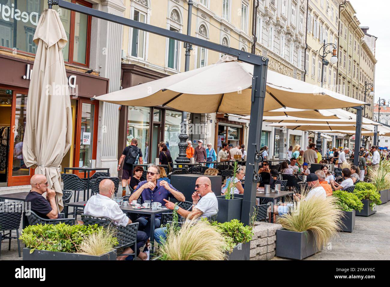 Local residents senior men friends talking hi-res stock photography and ...