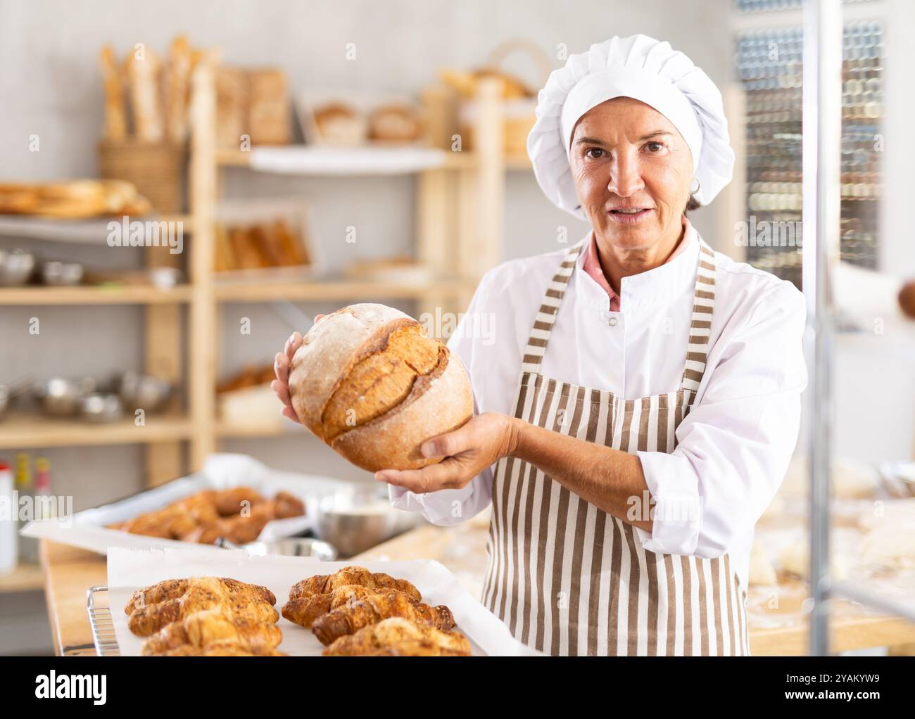 Hispanic woman making homemade meal hi-res stock photography and images ...