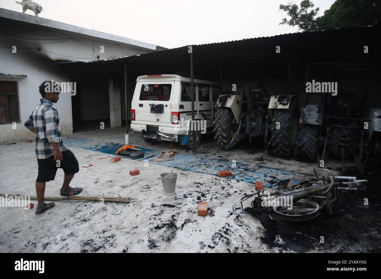 BAHARAICH, INDIA - OCTOBER 14: Vehicles burned by angry mob after a ...