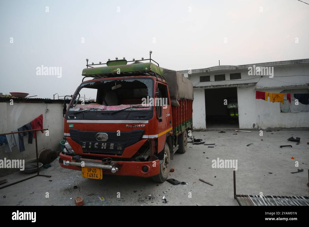 BAHARAICH, INDIA - OCTOBER 14: Vehicles vandalised by angry mob after a ...