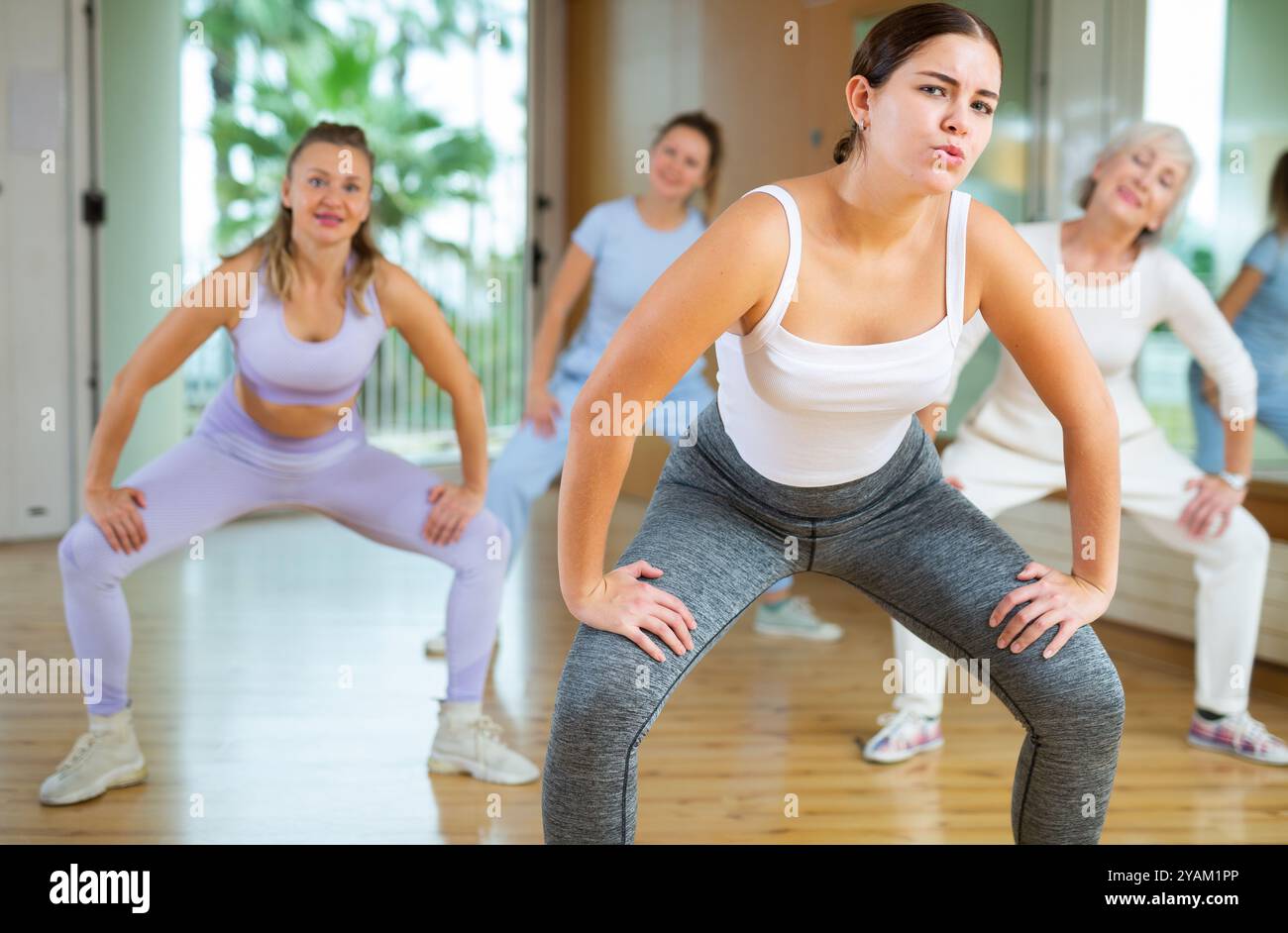 Active young woman practicing aerobic dance in training hall Stock ...