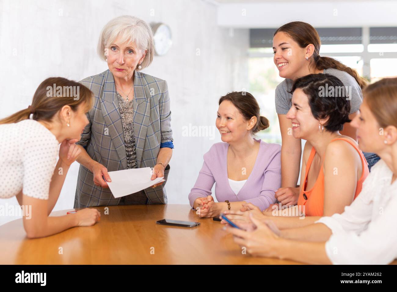 Senior woman participating in English language speaking club Stock ...