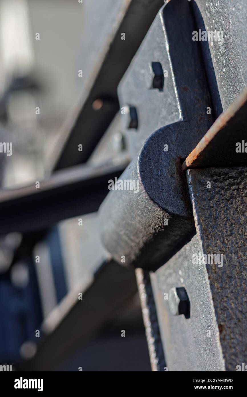 Close up of a metal hinge showing the details of welding and joining of ...