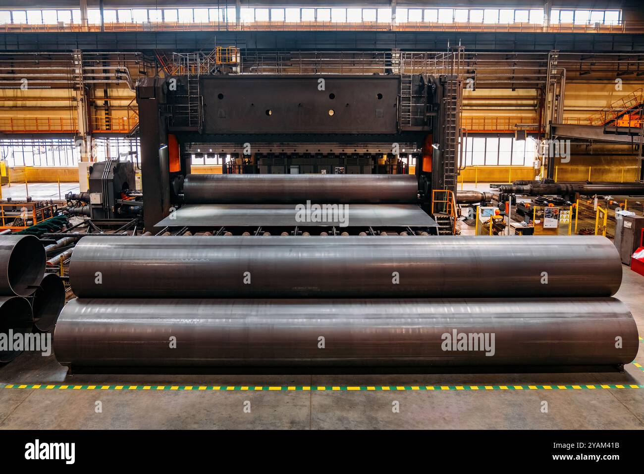 Pipe factory production line. Tube formation by LSAW pipe roll bending ...