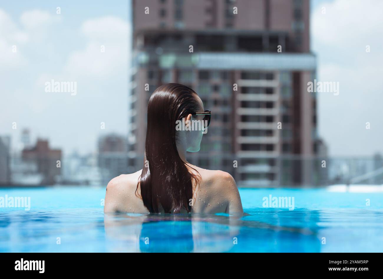 Woman on swimming pool hi-res stock photography and images - Alamy