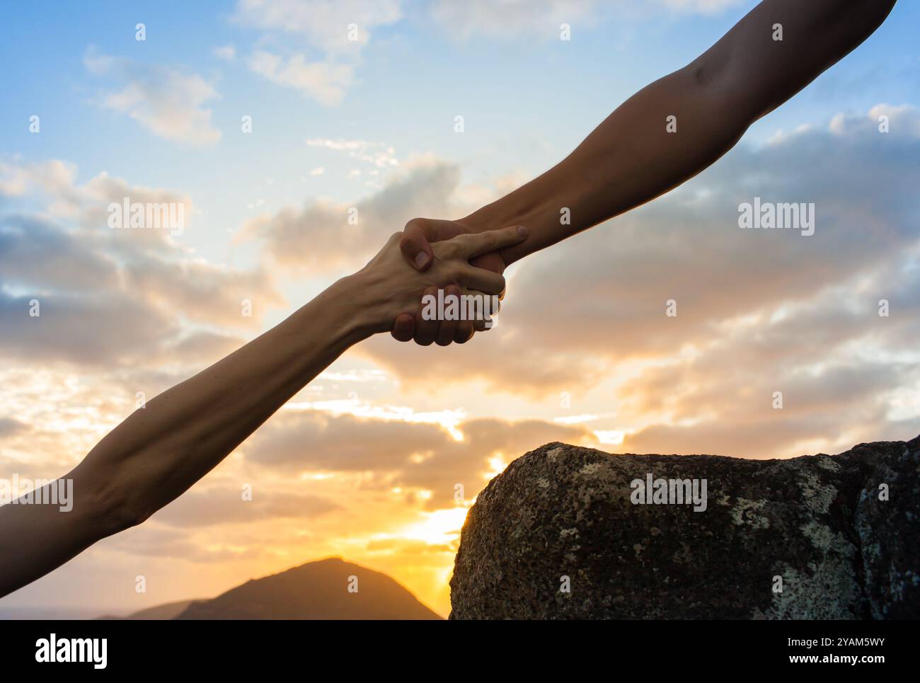 Man helping friend climbing up the mountain. Helping hands.help Stock ...