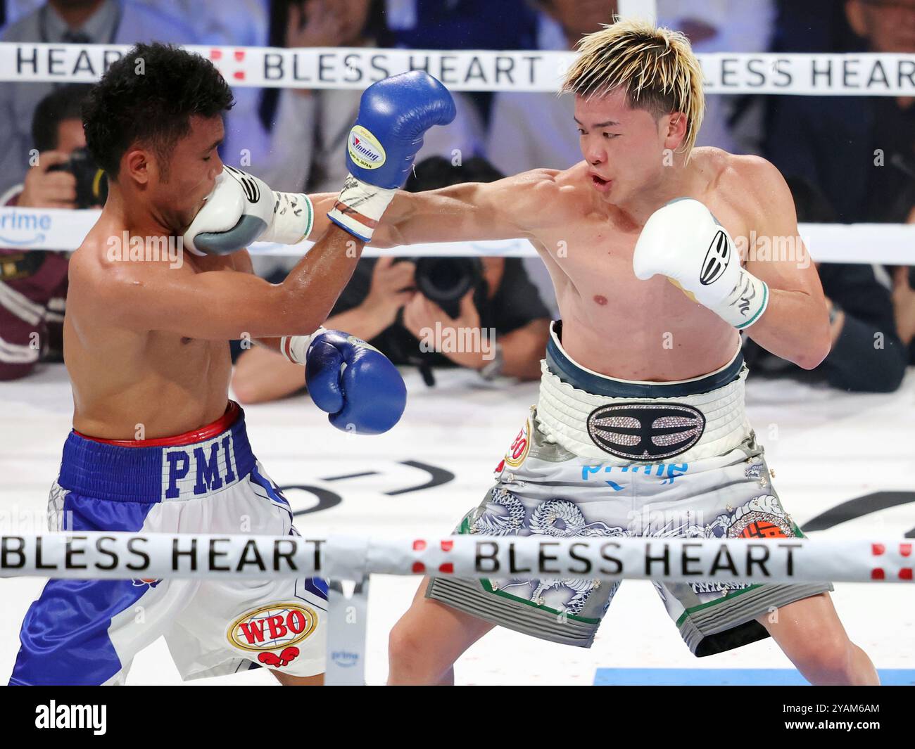 Tenshin Nasukawa of Japan (R) throws a punch in the 10th round of the ...