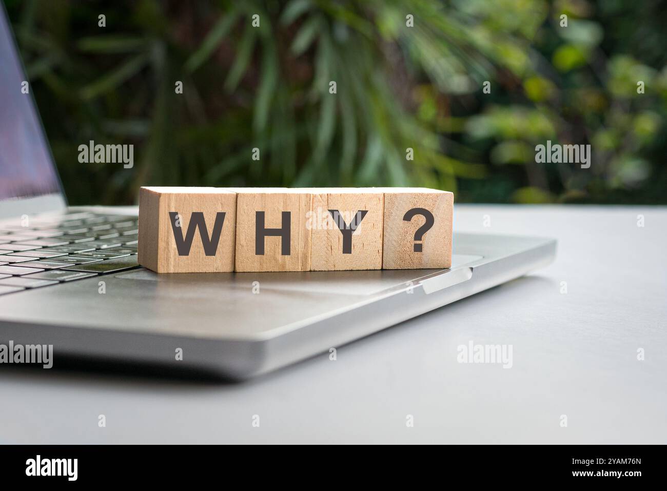 Why word written on square wood block, on top of computer laptop Stock ...