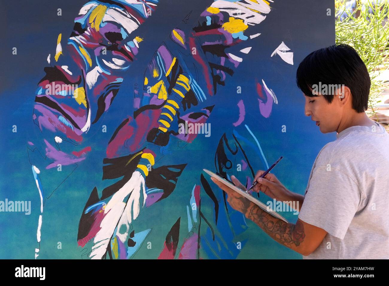 Artist Richelle Key works on the painting "Democracy Is Indigenous ...