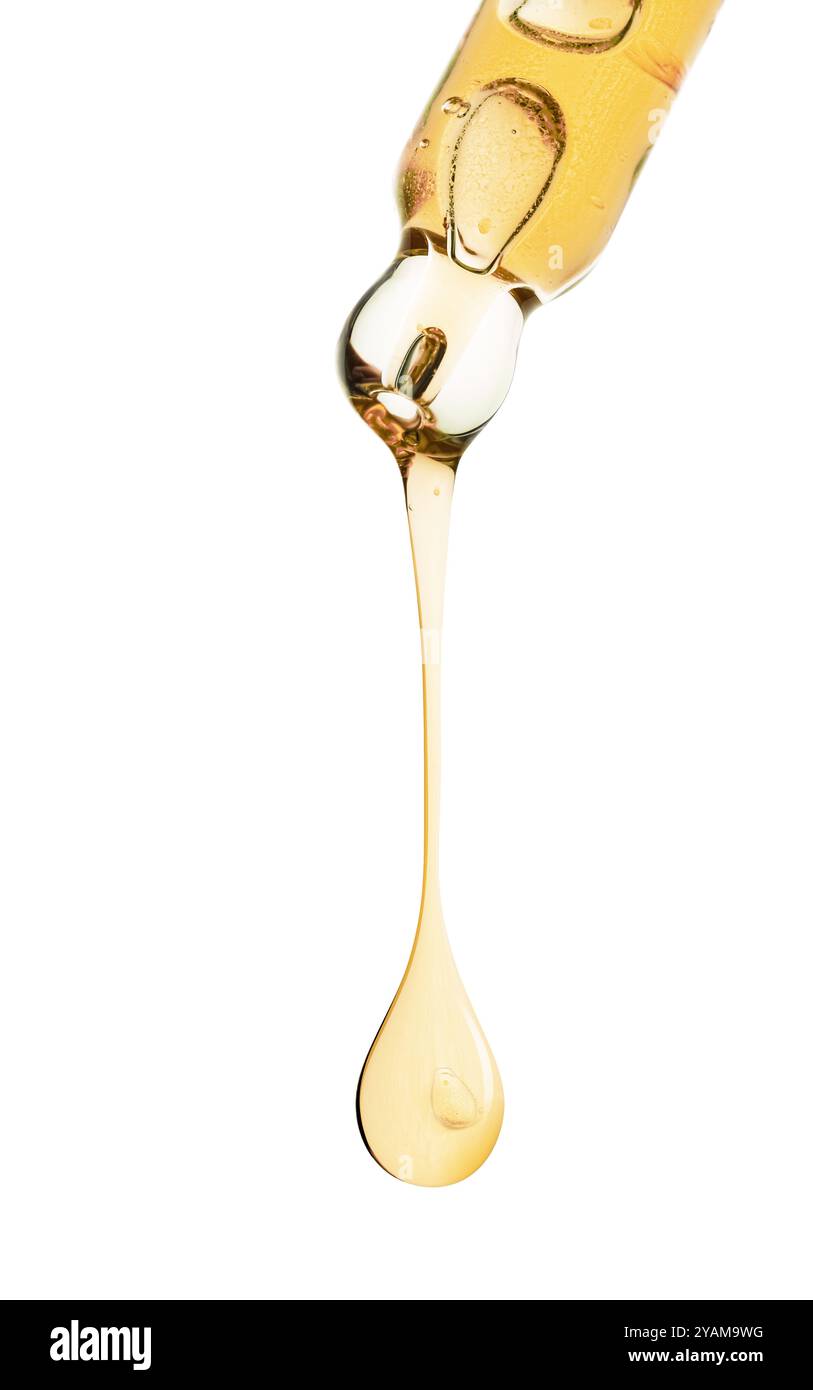 Cosmetic oil dripping from pipette on white background, closeup Stock ...