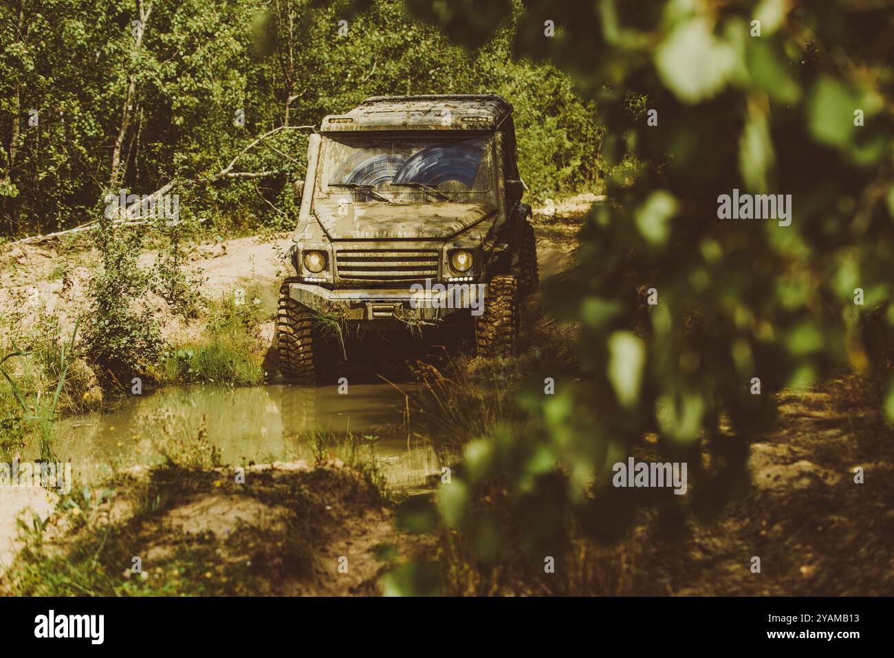 Off road sport truck between mountains landscape. Mud and water splash ...
