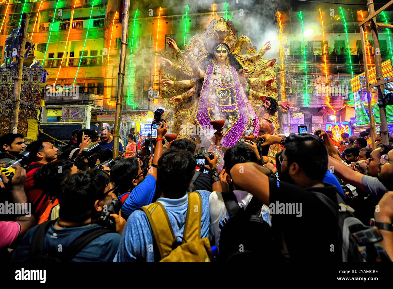 Kolkata, India. 14th Oct, 2024. Photographers take photos of a clay ...
