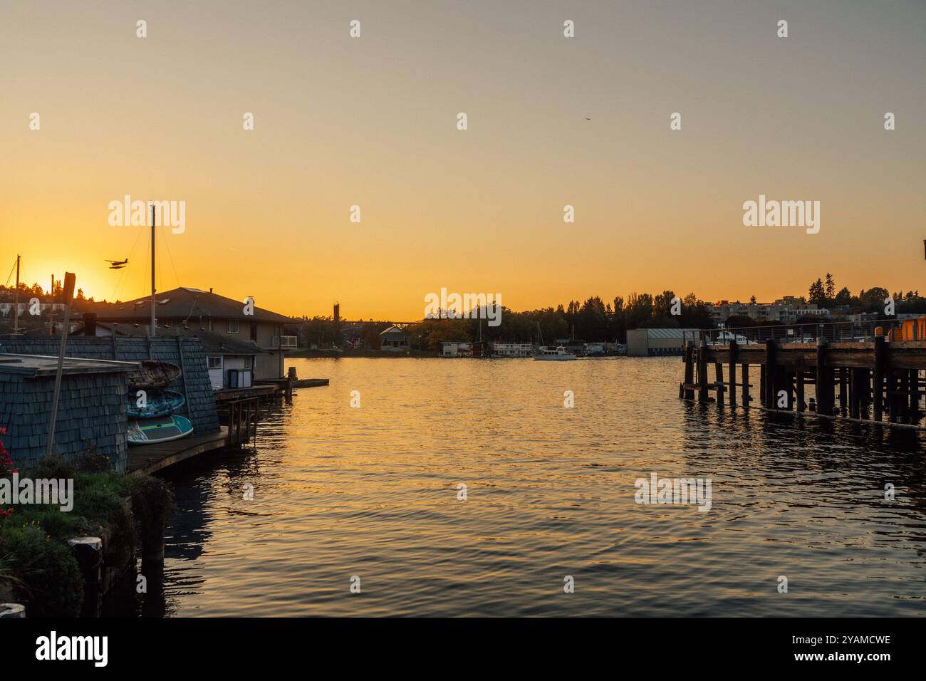 sunset from Eastlake in Seattle with seaplane landing on Lake Union ...