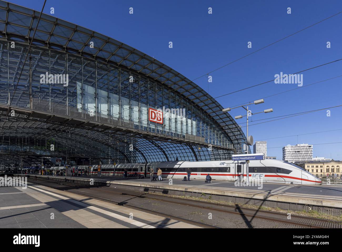 Central station with Deutsche Bahn AG logo, pillarless glass roof ...