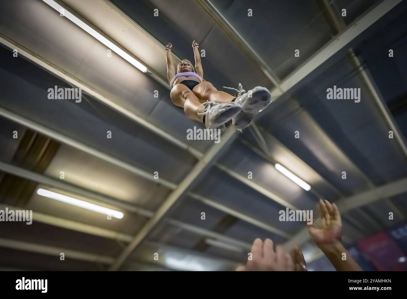 A toned gymnast perfects her routines at the gym ahead of a competition ...