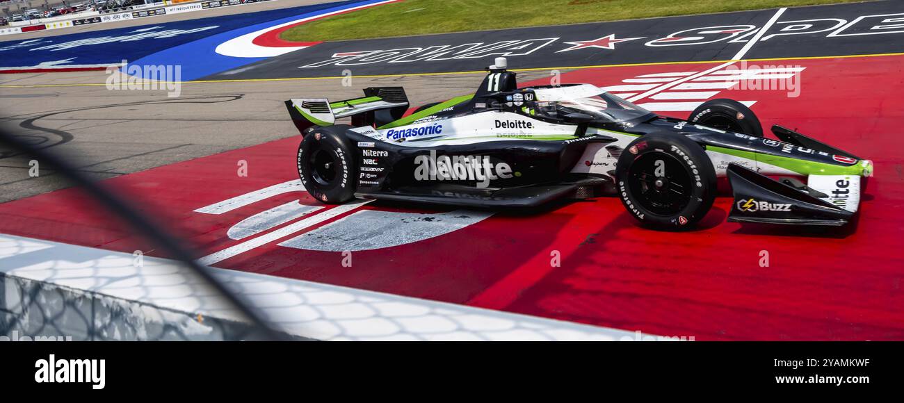 INDYCAR Driver, Takuma Sato (11) of Tokyo, Japan, crosses the finish ...