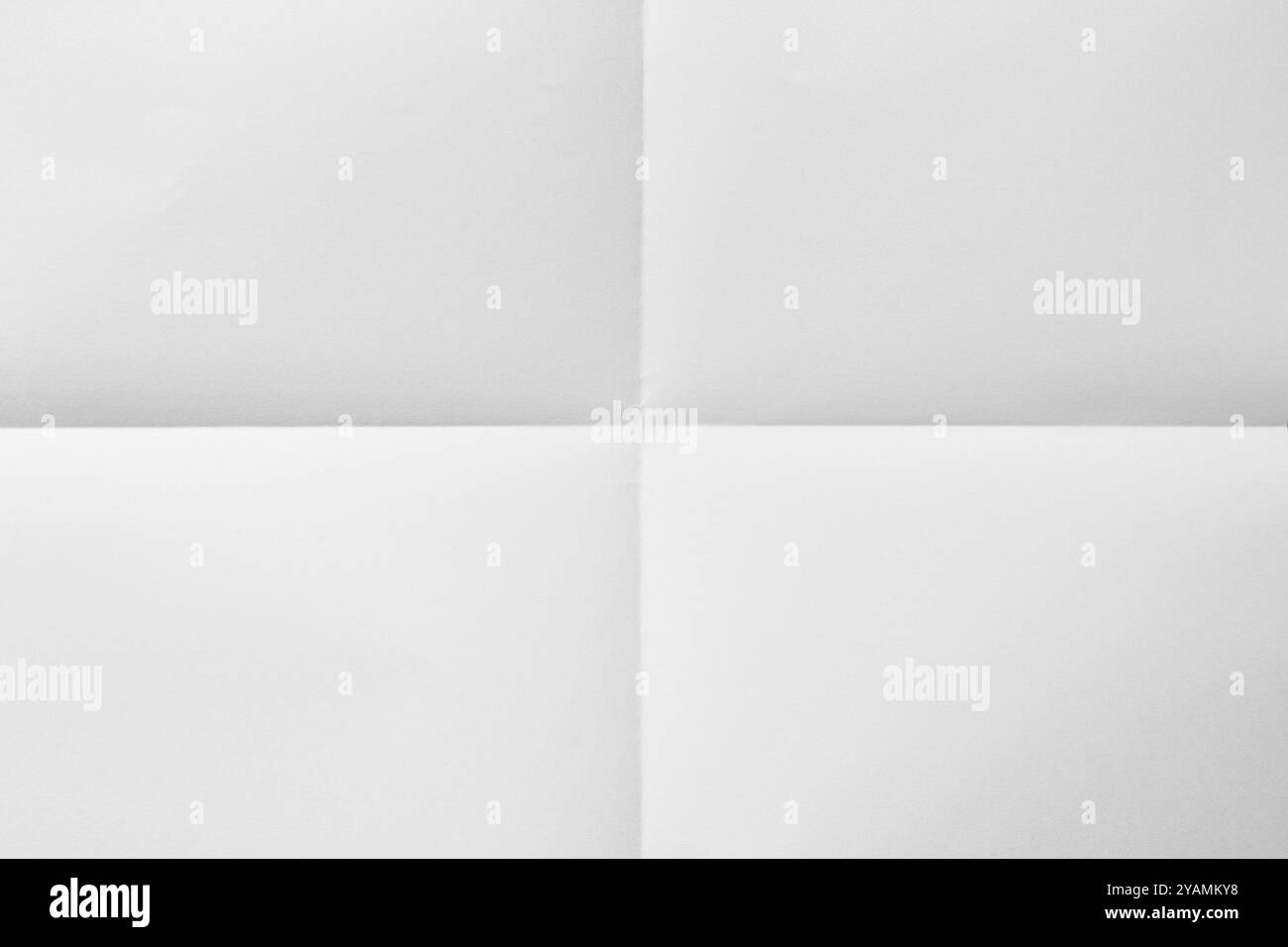 White paper folded into four parts background Stock Photo - Alamy