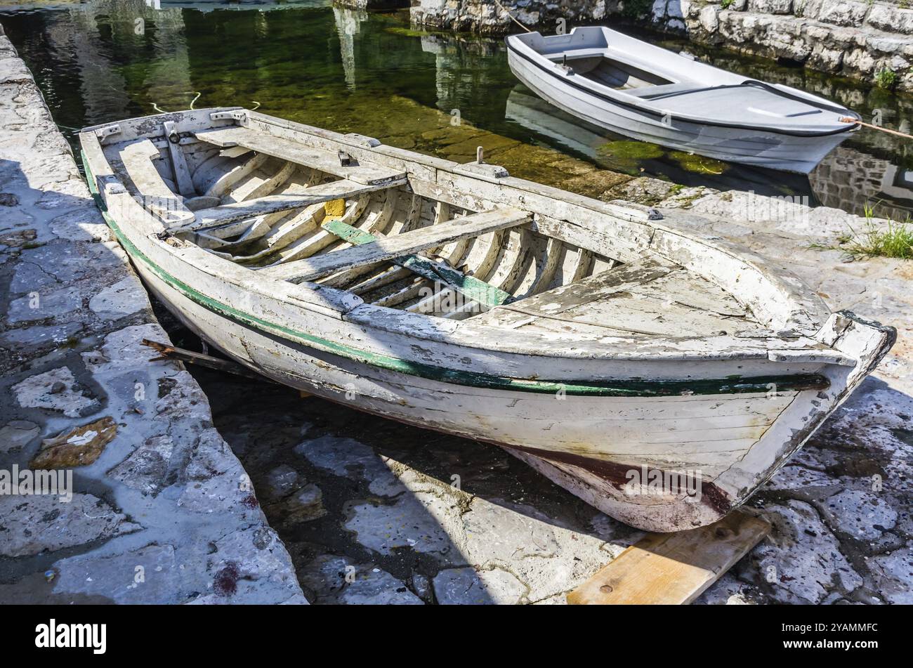 Old white wooden boat in Perast, Montenegro, Europe Stock Photo - Alamy