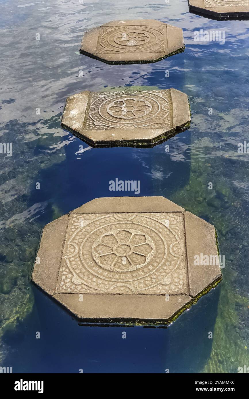 Closeup view on step of water stair in the pond in Tirta Gangga temple ...