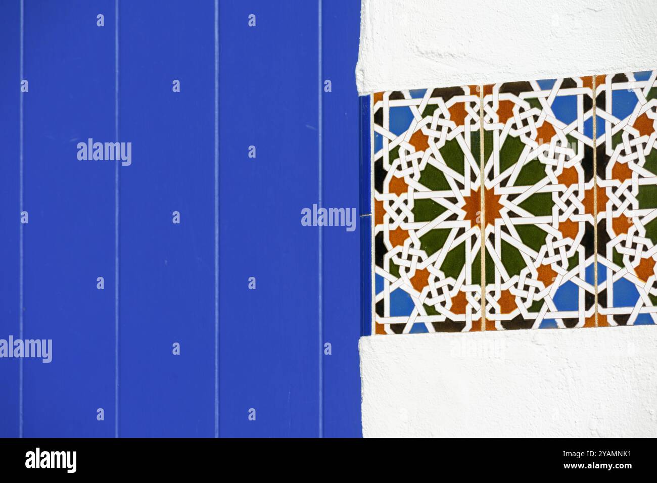 Decorative tiles with complex, interwoven patterns stand out against a ...