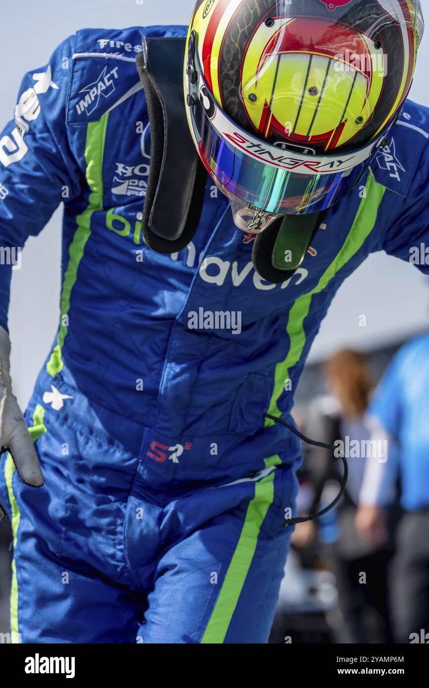 INDYCAR driver, STING RAY ROBB (R) (51) of Payette, Idaho, prepares to ...